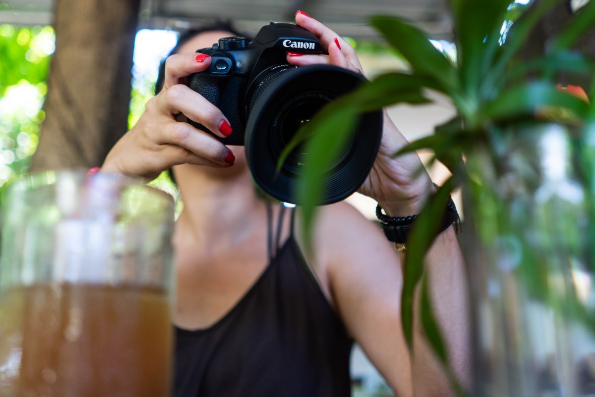 100+ Free Photos - Young woman holding Canon Camera